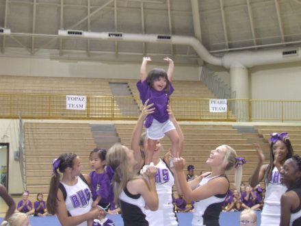 Young girls flip, twirl and crank out school spirit at cheer camp - The ...